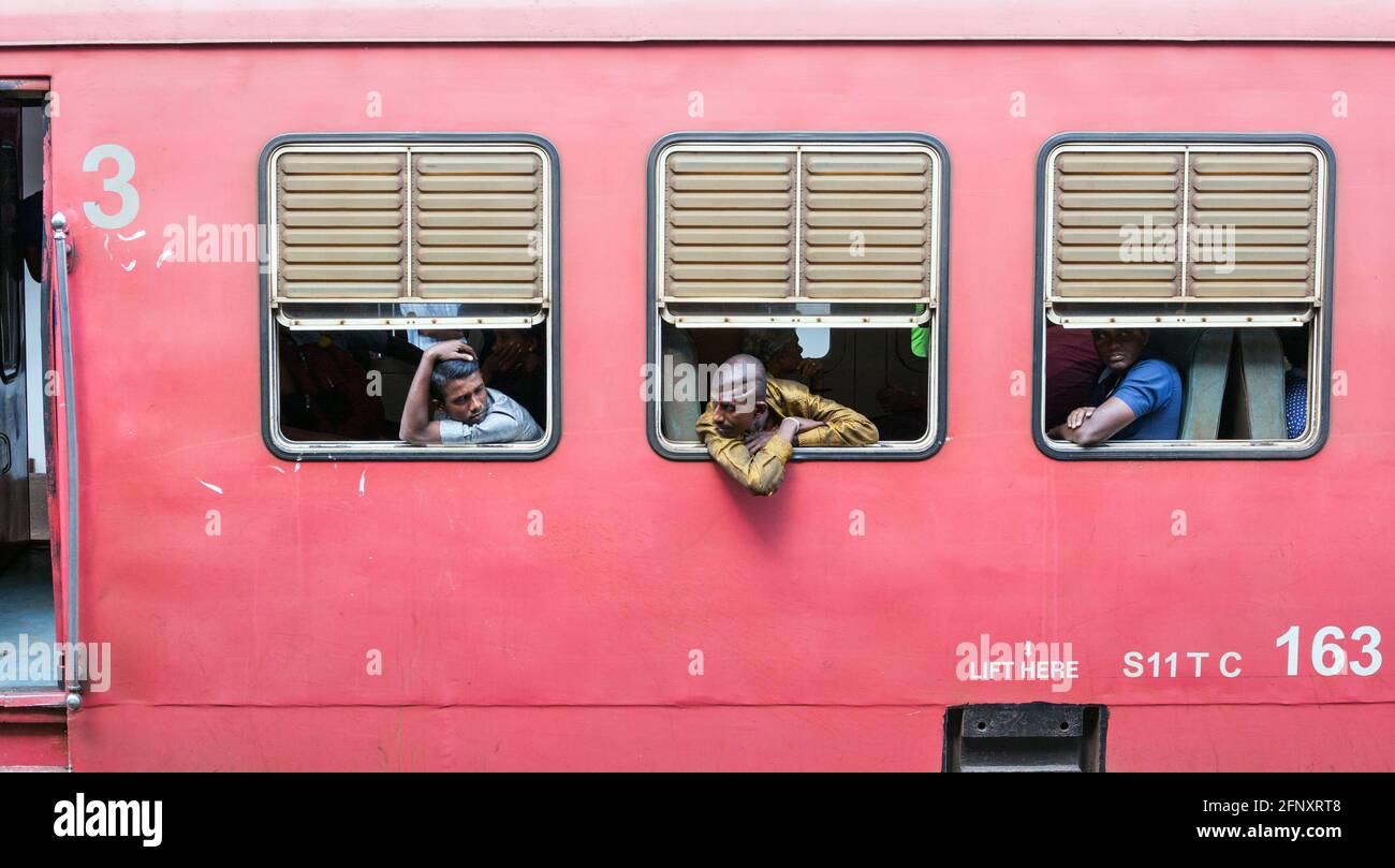 Sri Lankan male with distinctive scar on his skull looks out of window ...