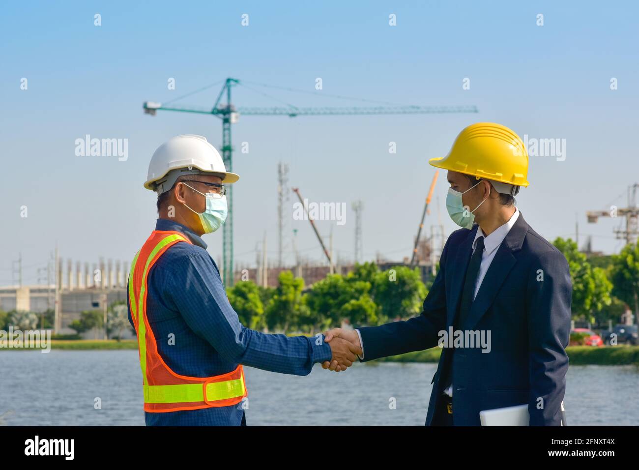 Two people Engineer teamwork outdoor working on site construction Stock ...