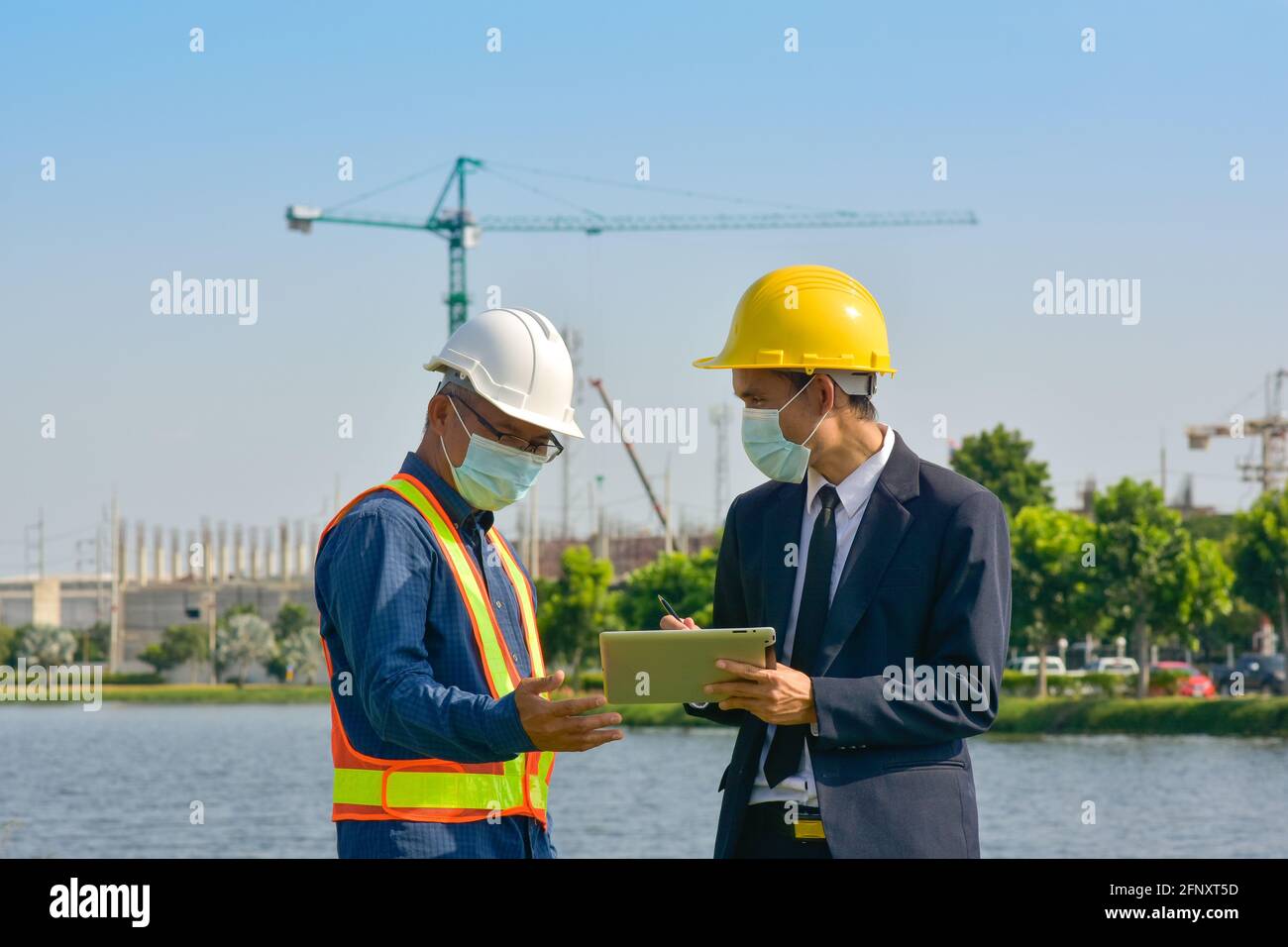 Two people Engineer teamwork outdoor working on site construction Stock ...