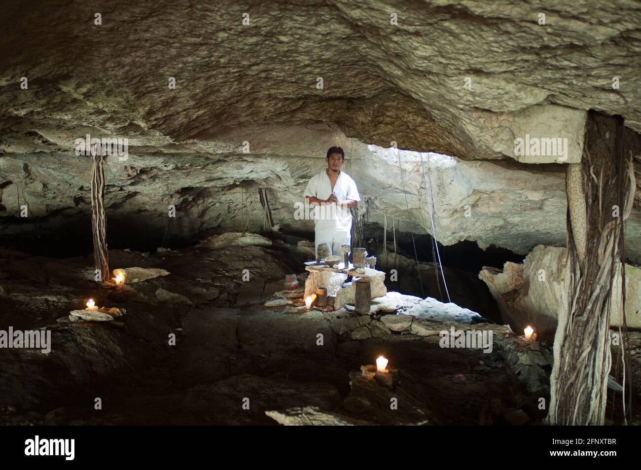 Mayan priest celebrating a ritual in a cave Stock Photo - Alamy