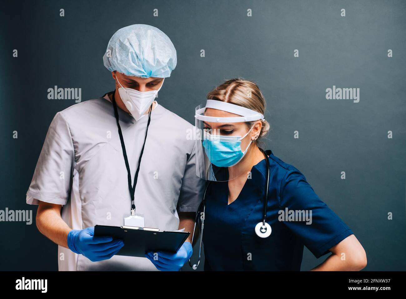 Portrait of hospital workers nurses colleagues in medical protective ...