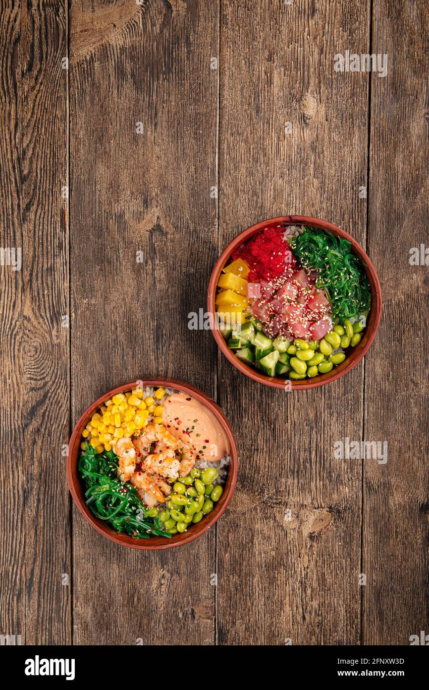 Two hawaiian poke bowls with tuna fish and shrimp Stock Photo - Alamy