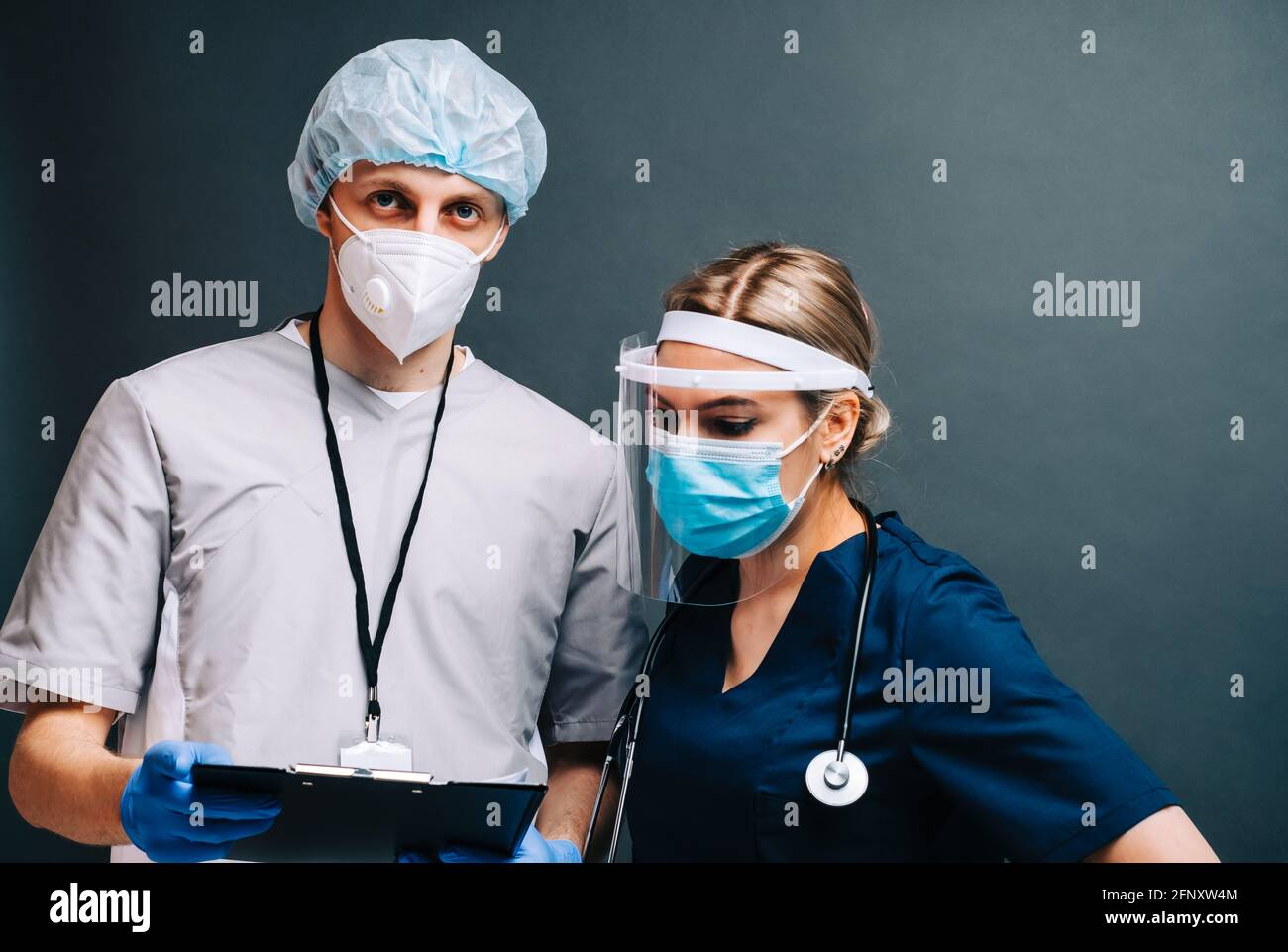 Portrait of hospital workers nurses colleagues in medical protective ...