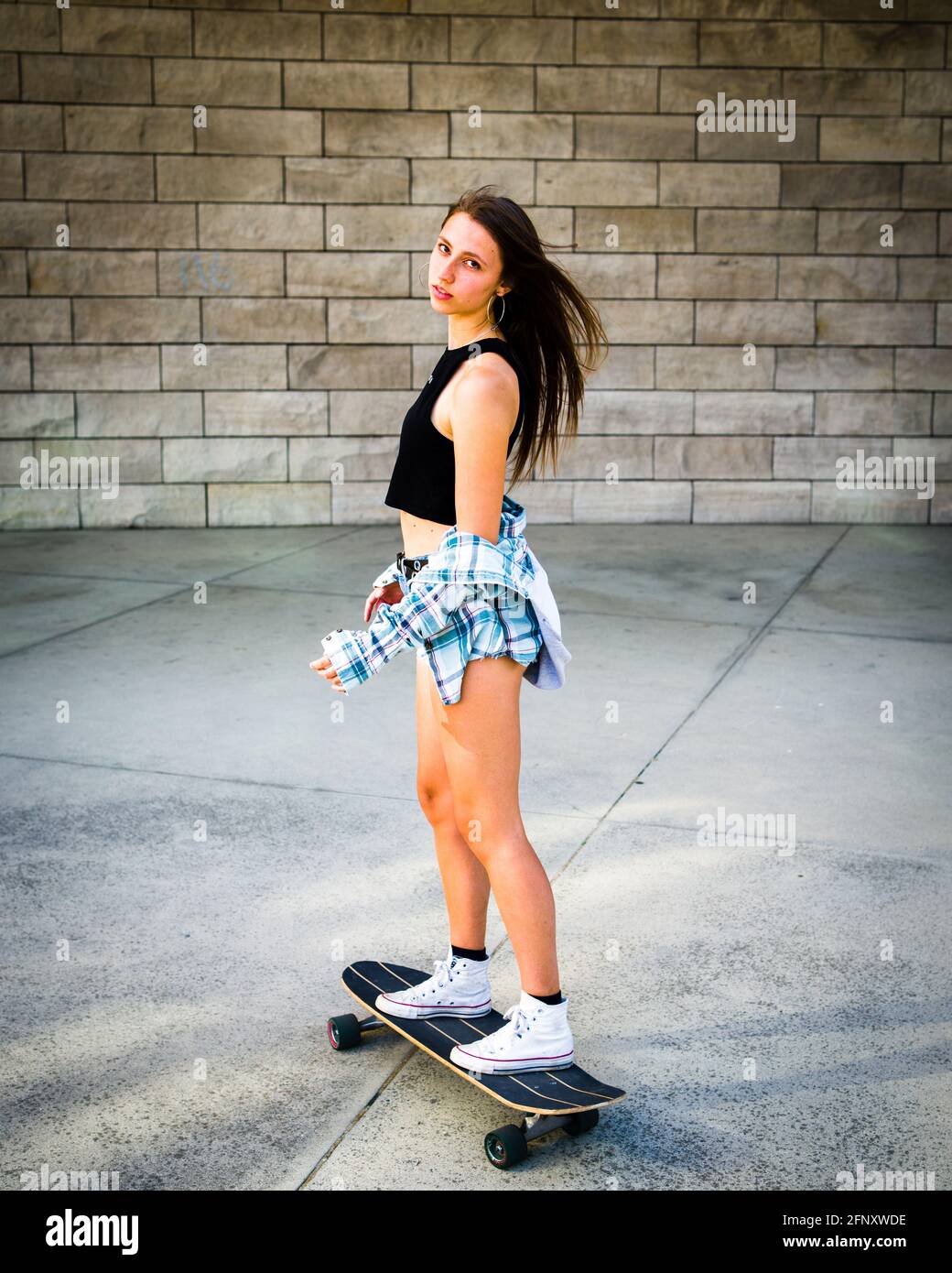 Brunette Girl Riding Penny Board