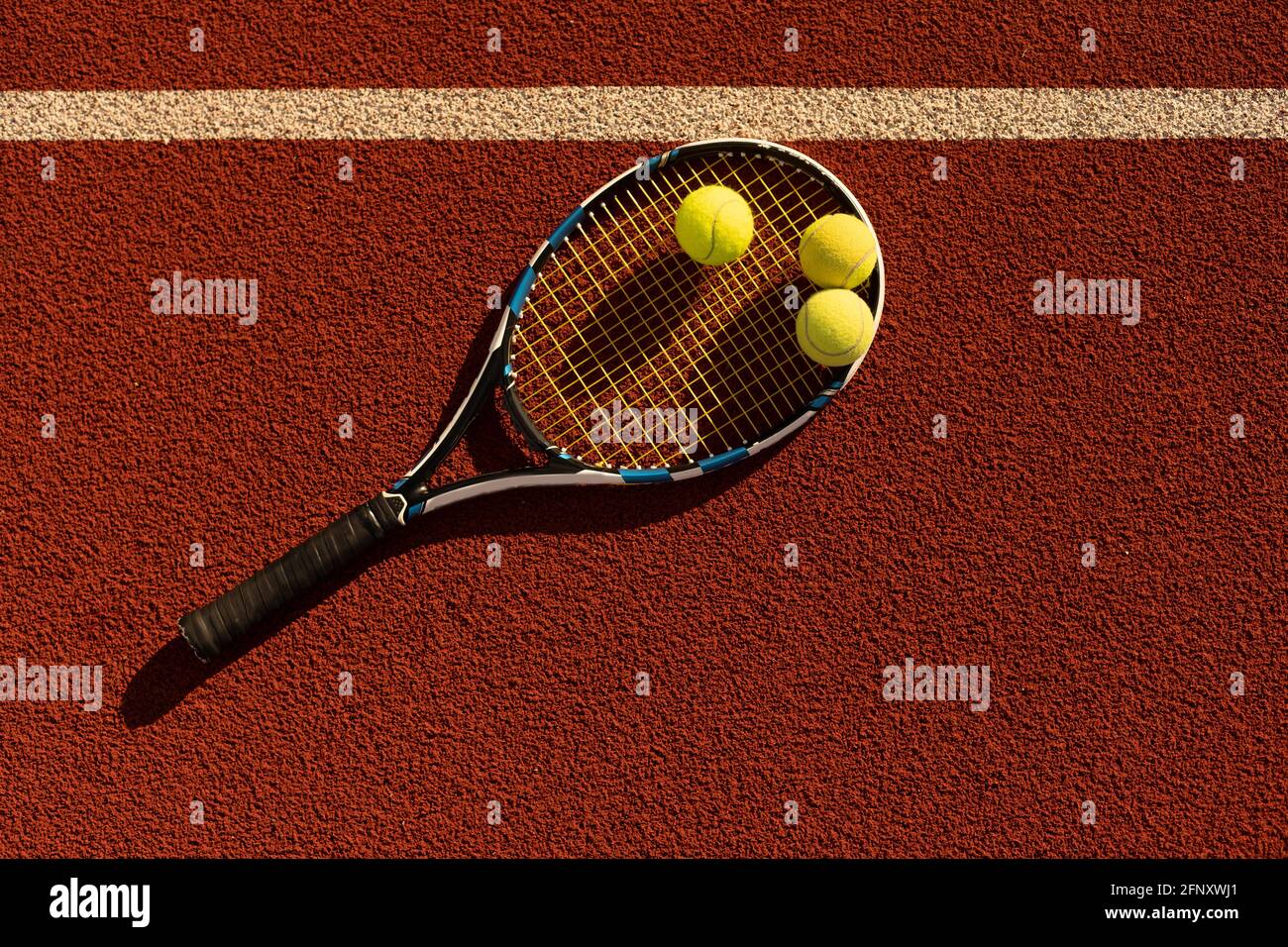 Close up view of two tennis rackets and balls on the tennis court Stock ...