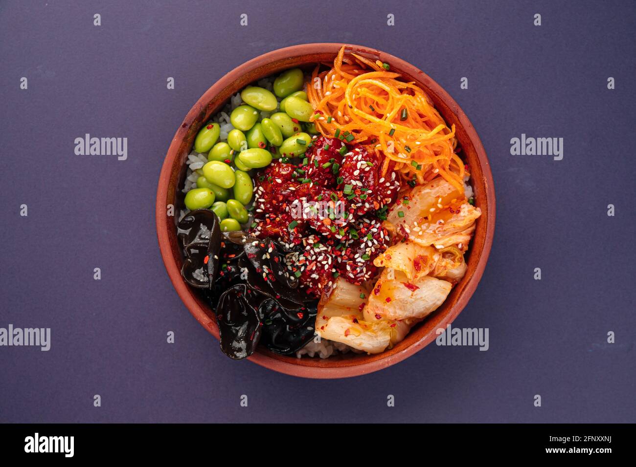 Hawaiian spicy chicken poke bowl with kimchi Stock Photo - Alamy