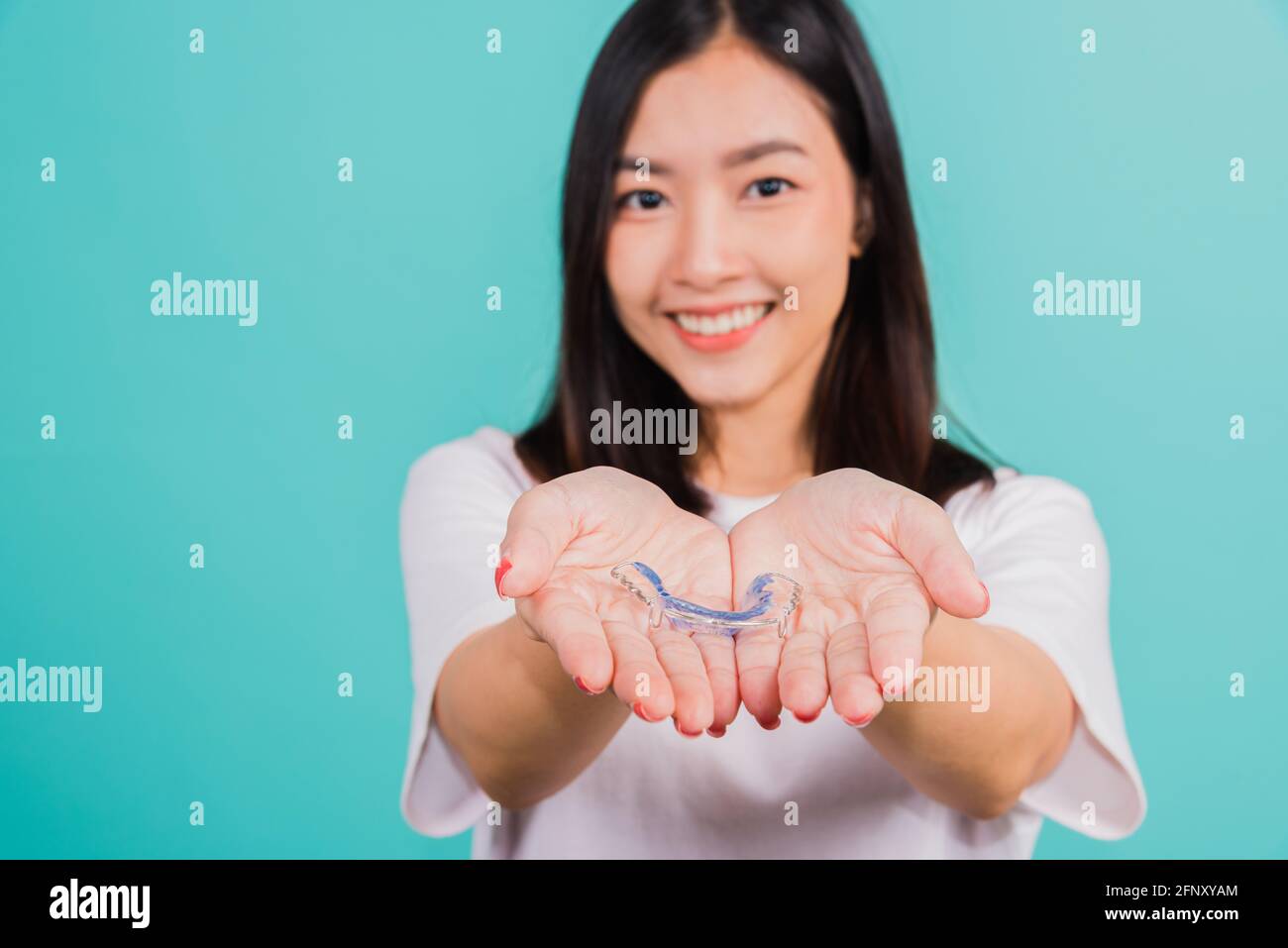 Portrait young Asian beautiful woman smiling holding silicone ...