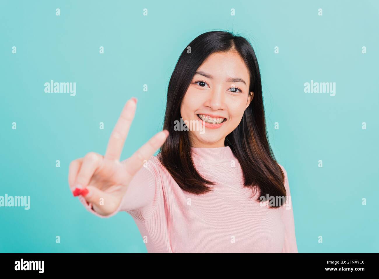 Young Asian beautiful woman smiling wear silicone orthodontic retainers ...