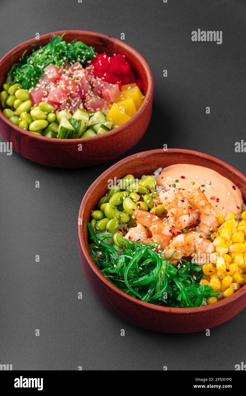 Two hawaiian poke bowls with tuna fish and shrimp Stock Photo - Alamy