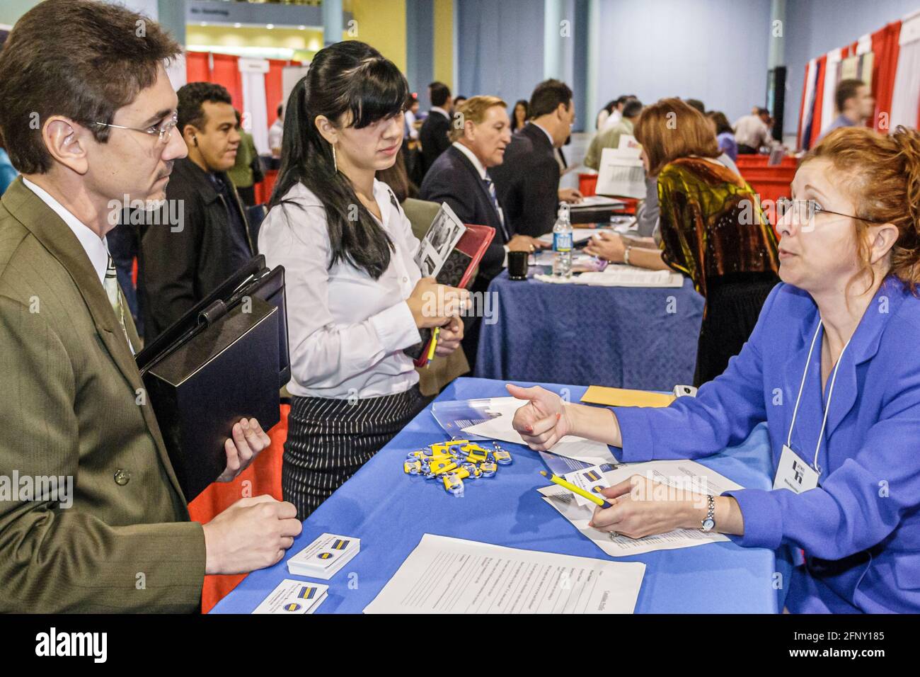 Employers vendor booth man woman female blockbuster video talking hi ...