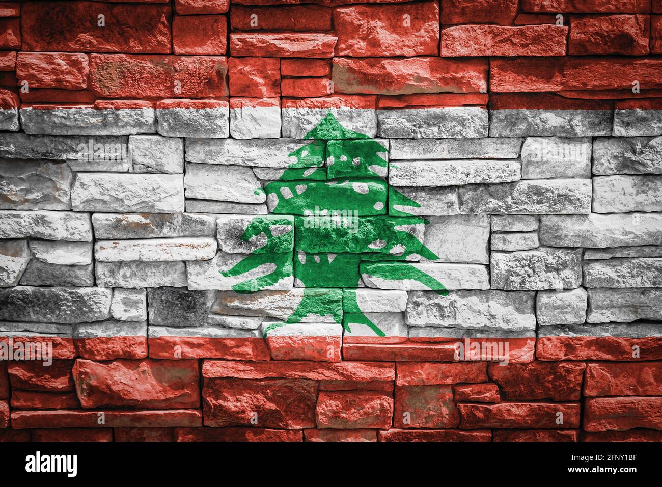 National flag of Lebanon on stone wall background.The concept of ...
