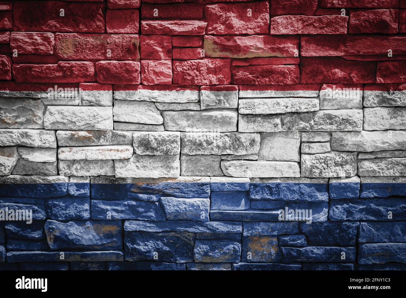National flag of Netherlands on stone wall background.The concept of ...
