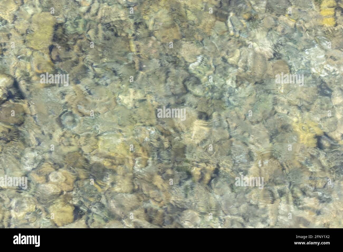 rocks distorted below the surface of water Stock Photo - Alamy