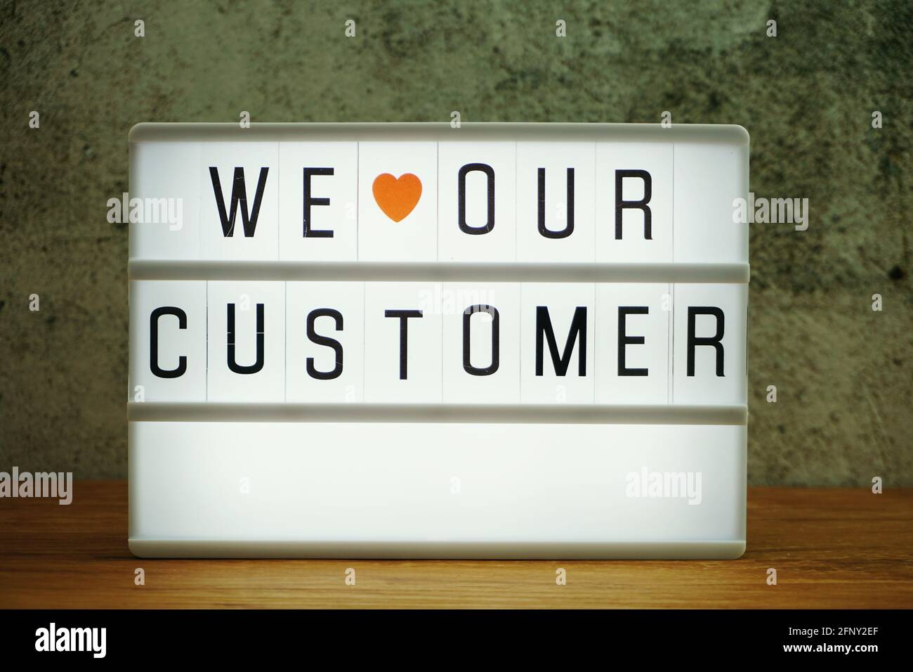 We love our customer word in light box business concept background ...