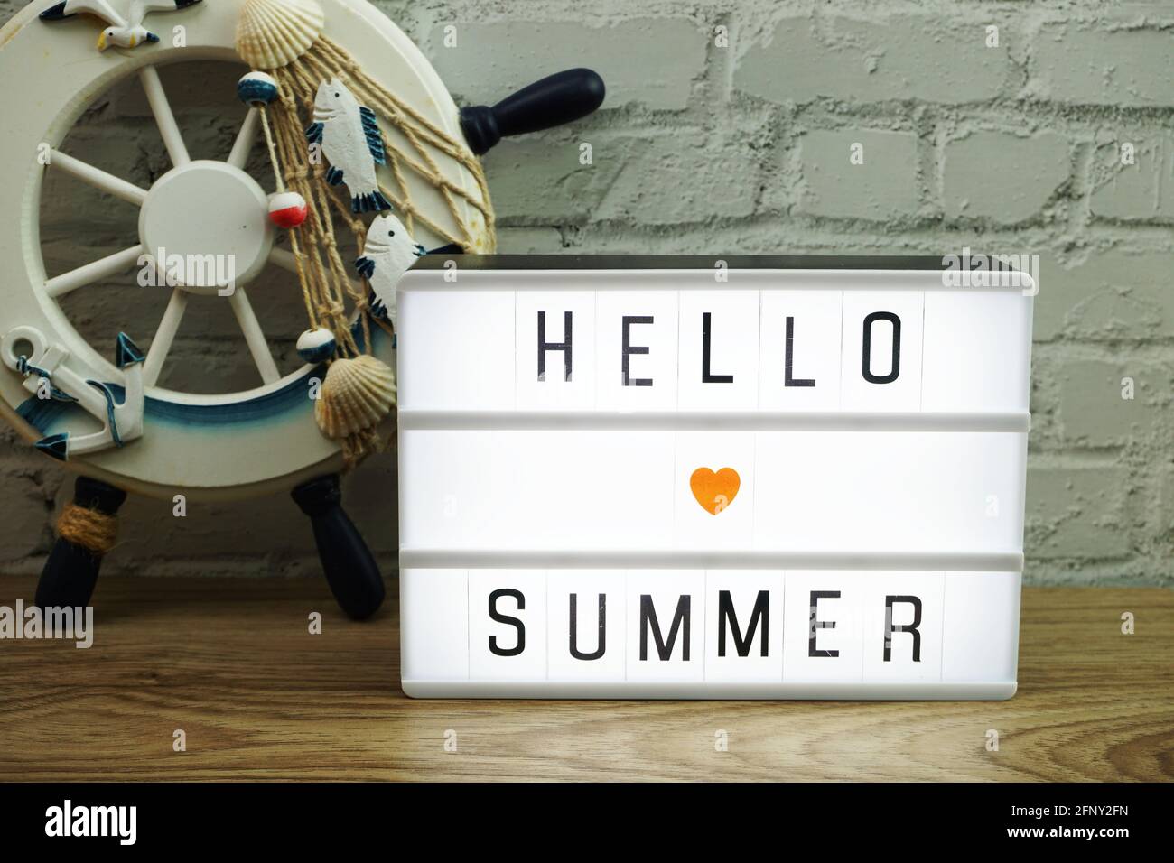 Hello Summer word in light box with mediterrean decoration on white ...