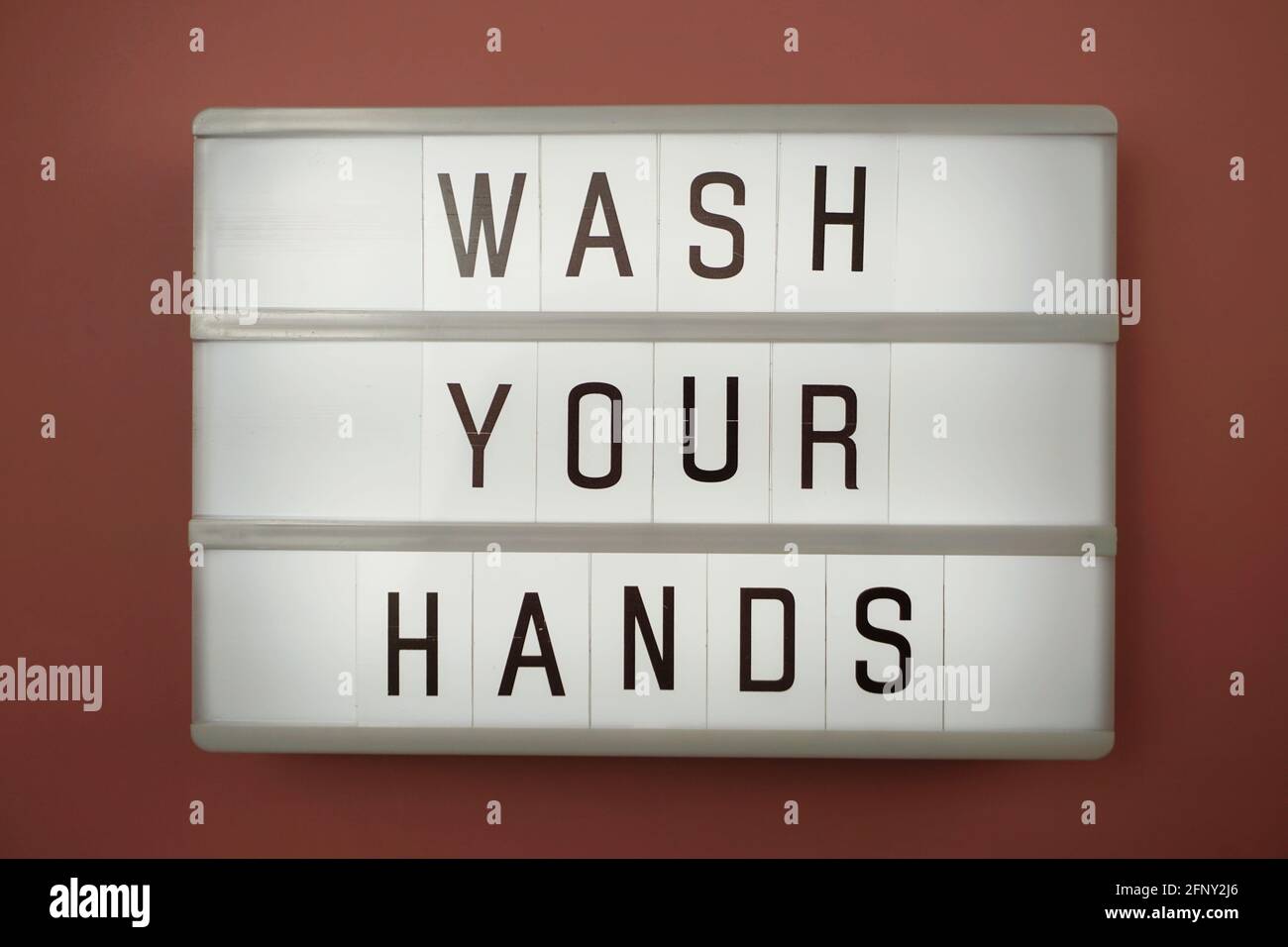 Flat lay Wash Your Hands word in light box with space coy on pink ...