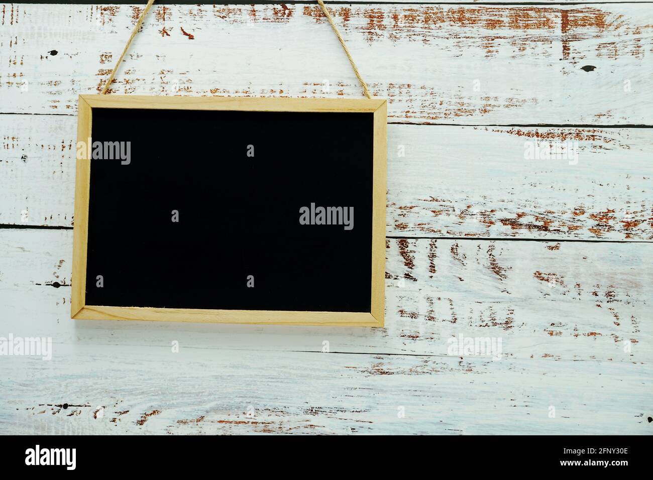 Empty black board on dark wooden wall texture background Stock Photo ...