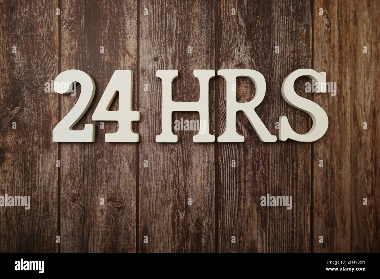 24 HRS alphabet letters with space copy on wooden background Stock ...