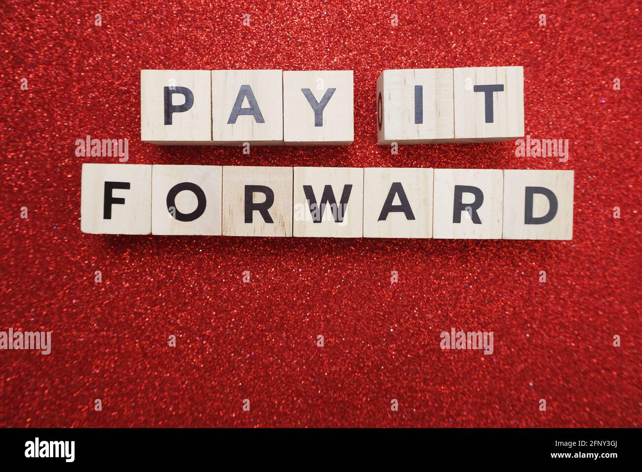 Pay It Forward alphabet letter on red glitter background Stock Photo ...