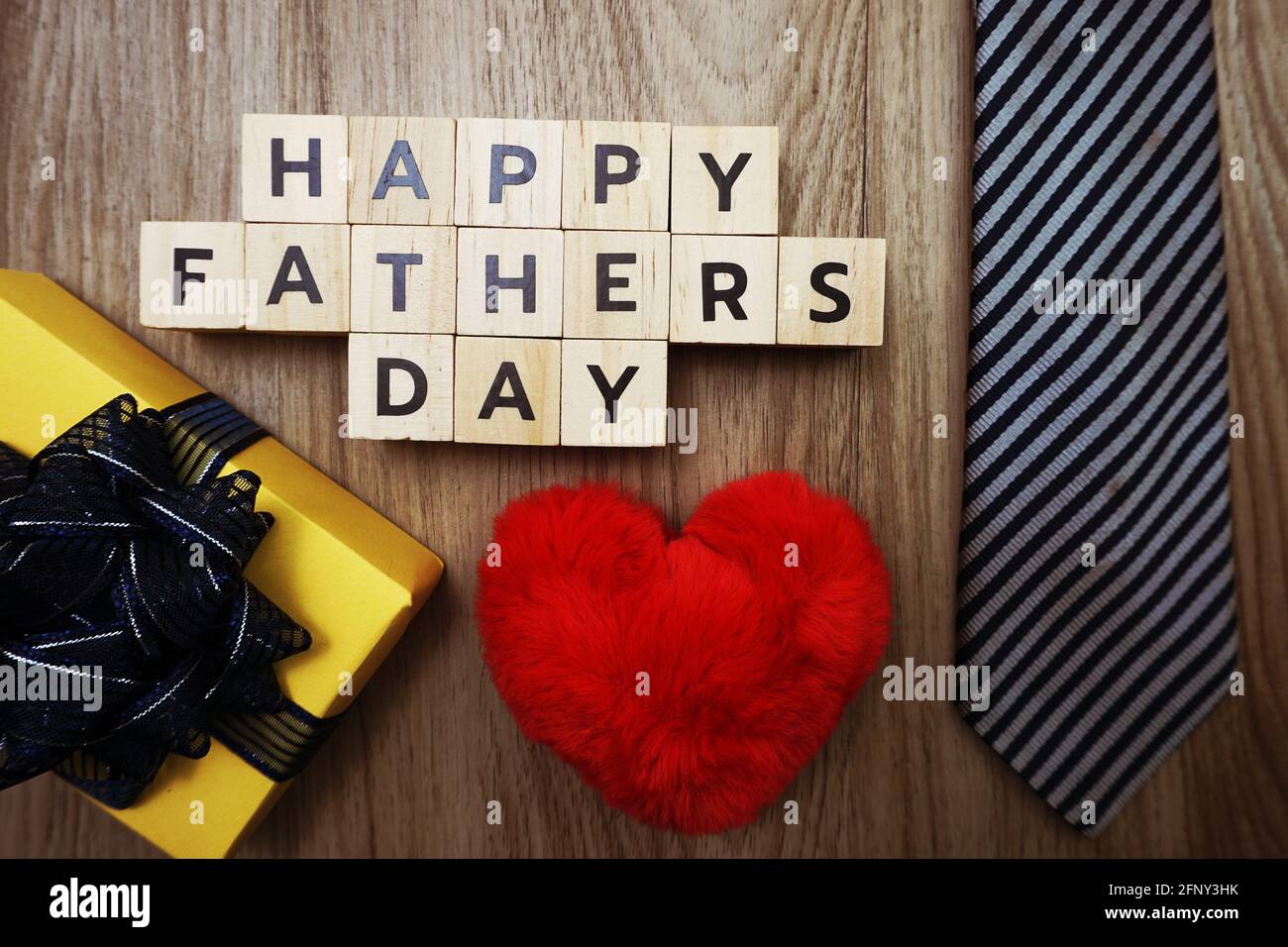 Happy Father's Day alphabet letters with necktie on wooden background ...