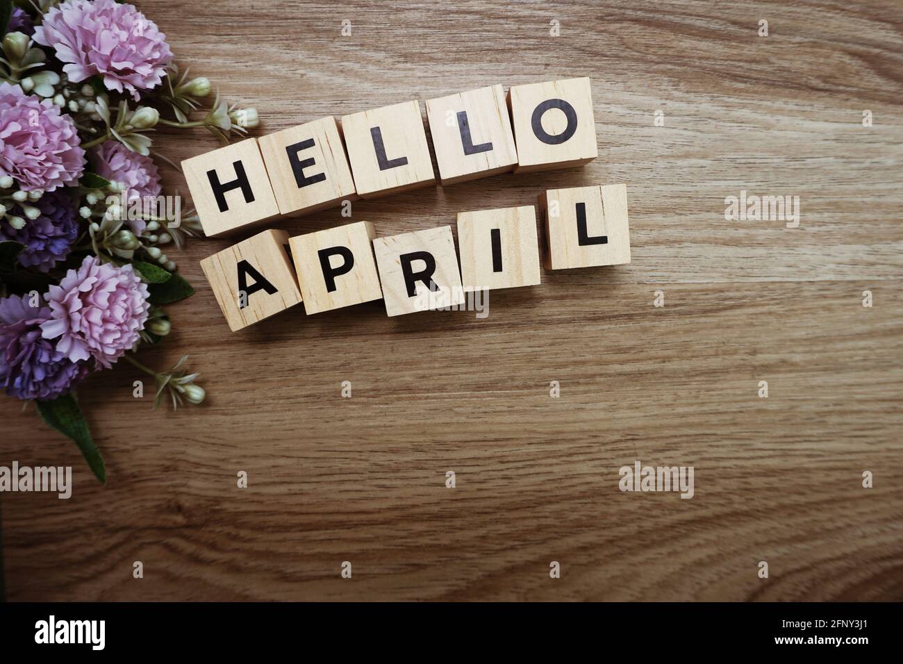 Hello April alphabet letters on wooden background Stock Photo - Alamy