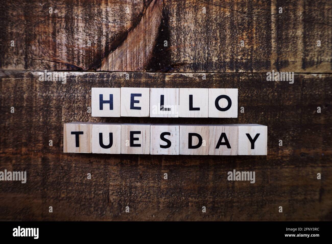 Hello Tuesday alphabet letters with space copy on wooden background ...