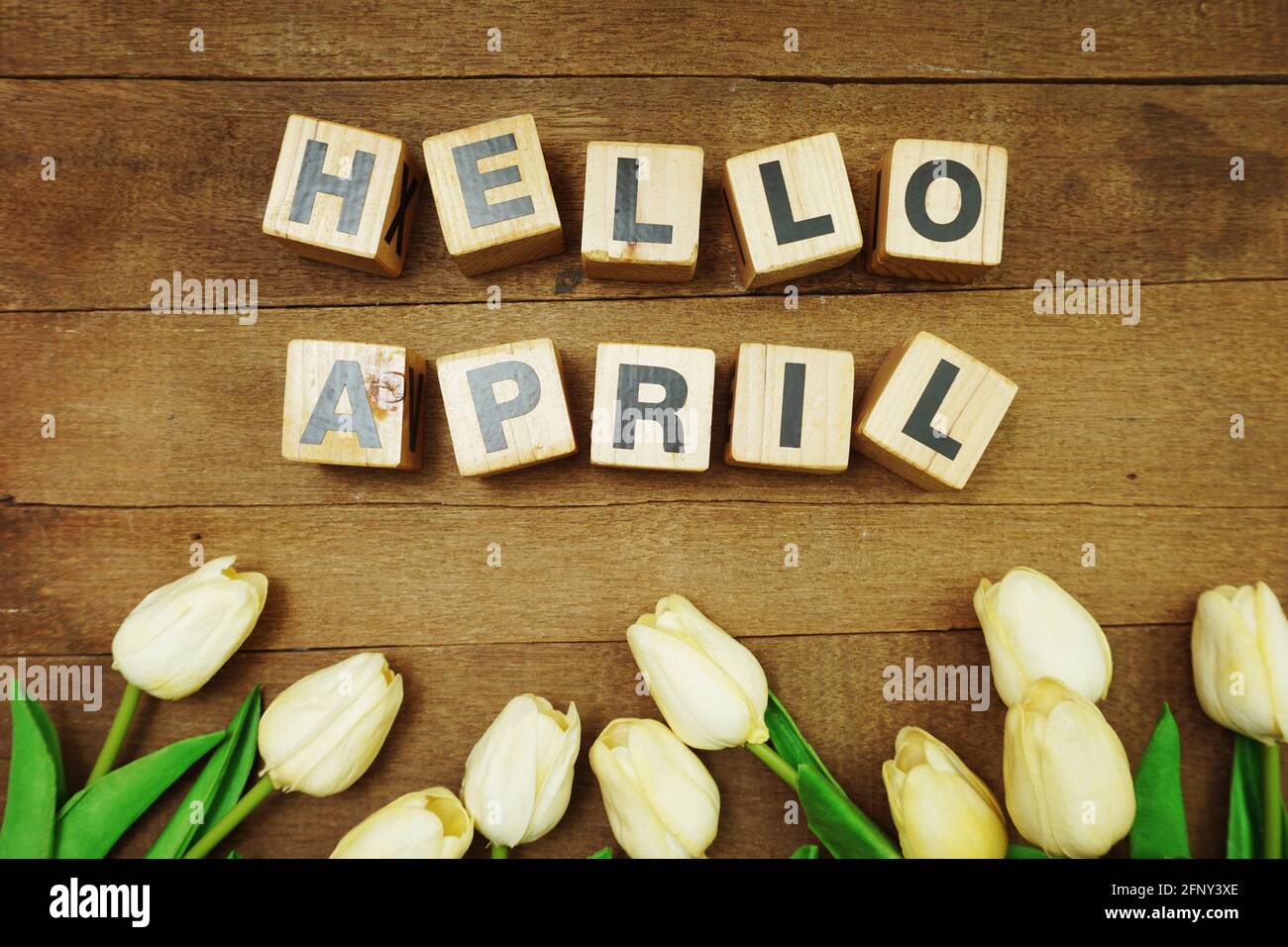 Hello April alphabet letters on wooden background Stock Photo - Alamy