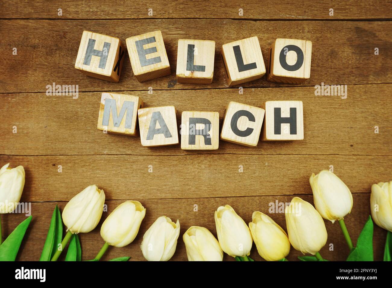 Hello March alphabet letters on wooden background Stock Photo - Alamy
