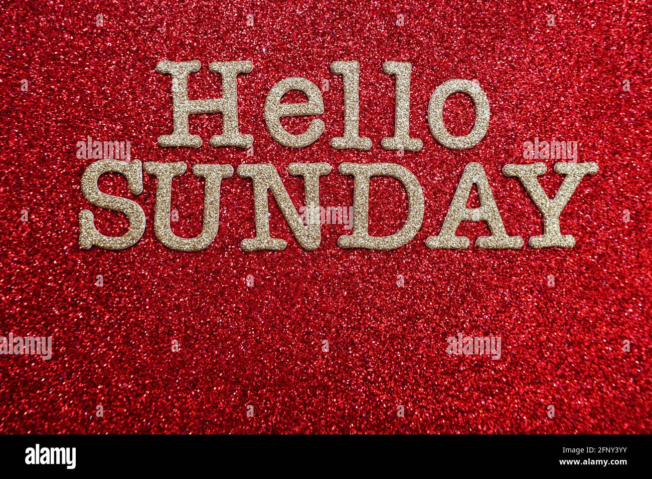 Hello Sunday alphabet letter on red glitter background Stock Photo - Alamy