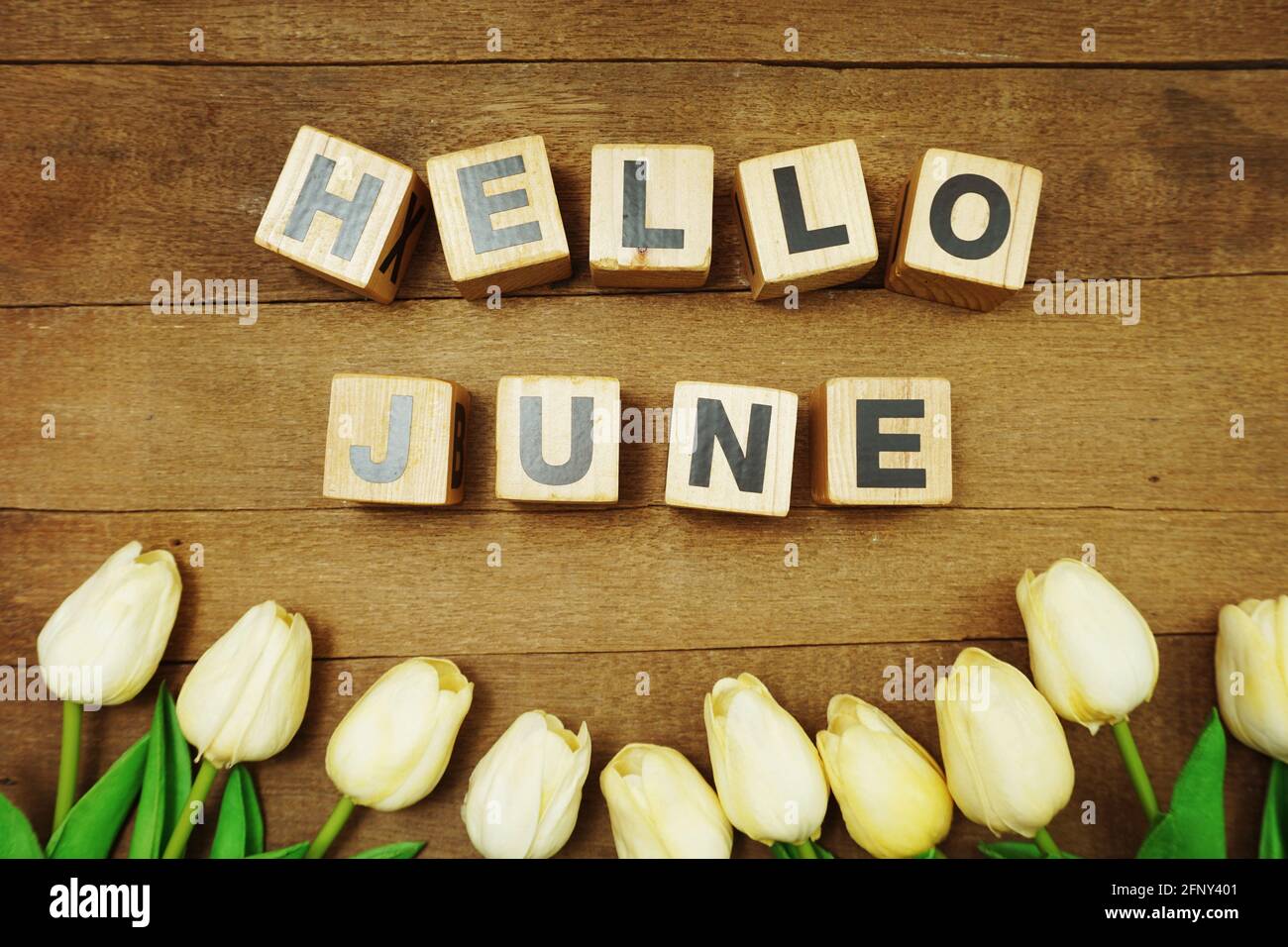 Hello June alphabet letters on wooden background Stock Photo - Alamy