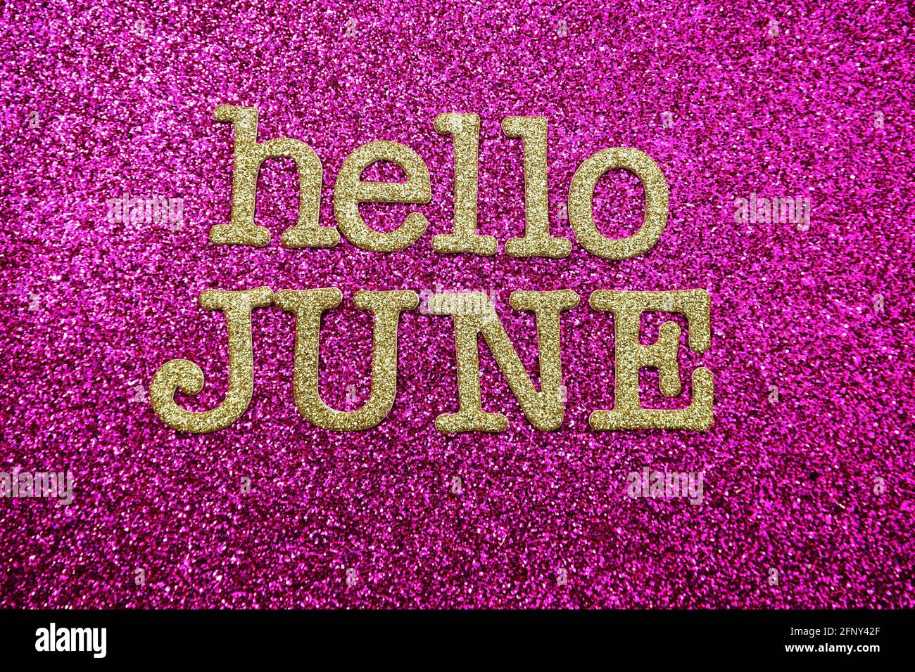 Hello June alphabet letter on pink glitter background Stock Photo - Alamy