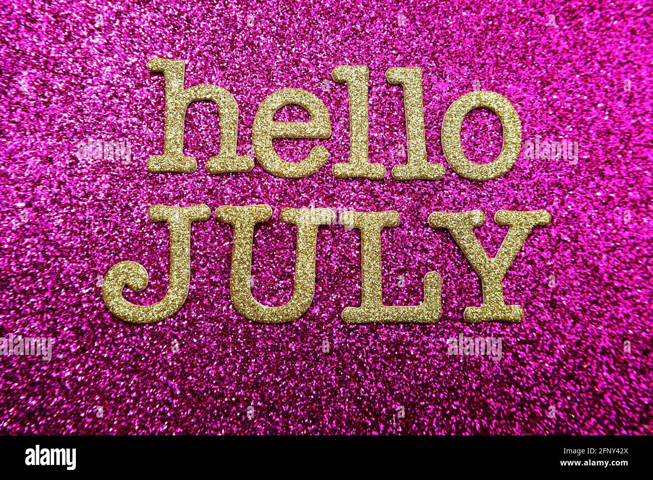 Hello July alphabet letters on pink glitter background Stock Photo - Alamy