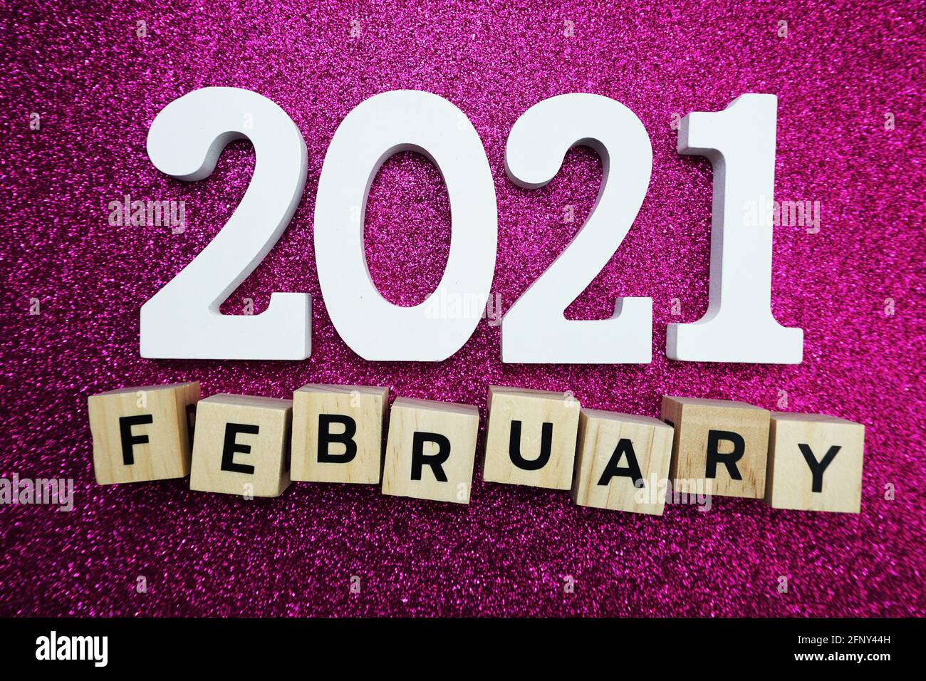 2021 February alphabet letters on pink glitter background Stock Photo ...