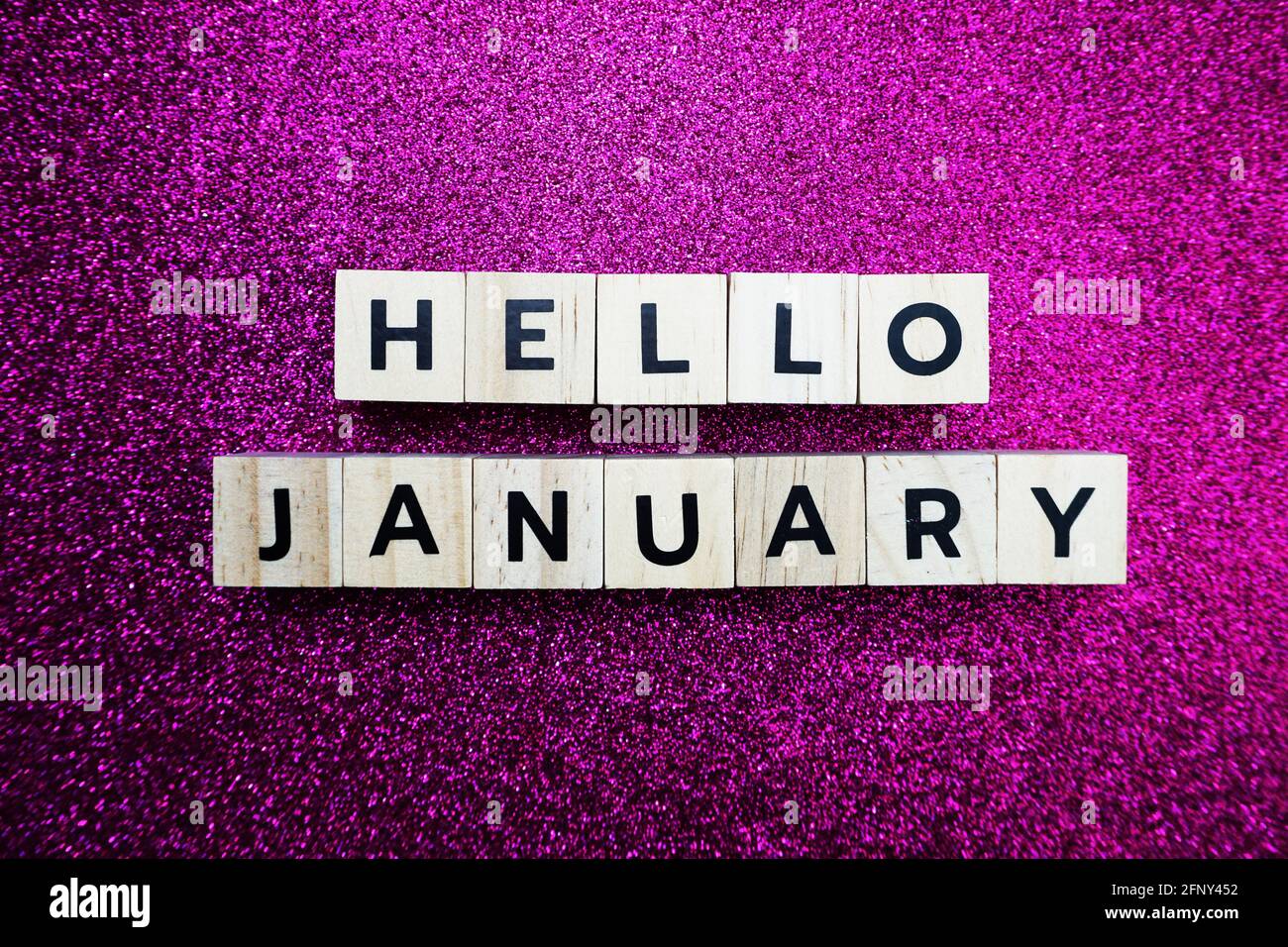 Hello January alphabet letters on purple glitter background Stock Photo ...
