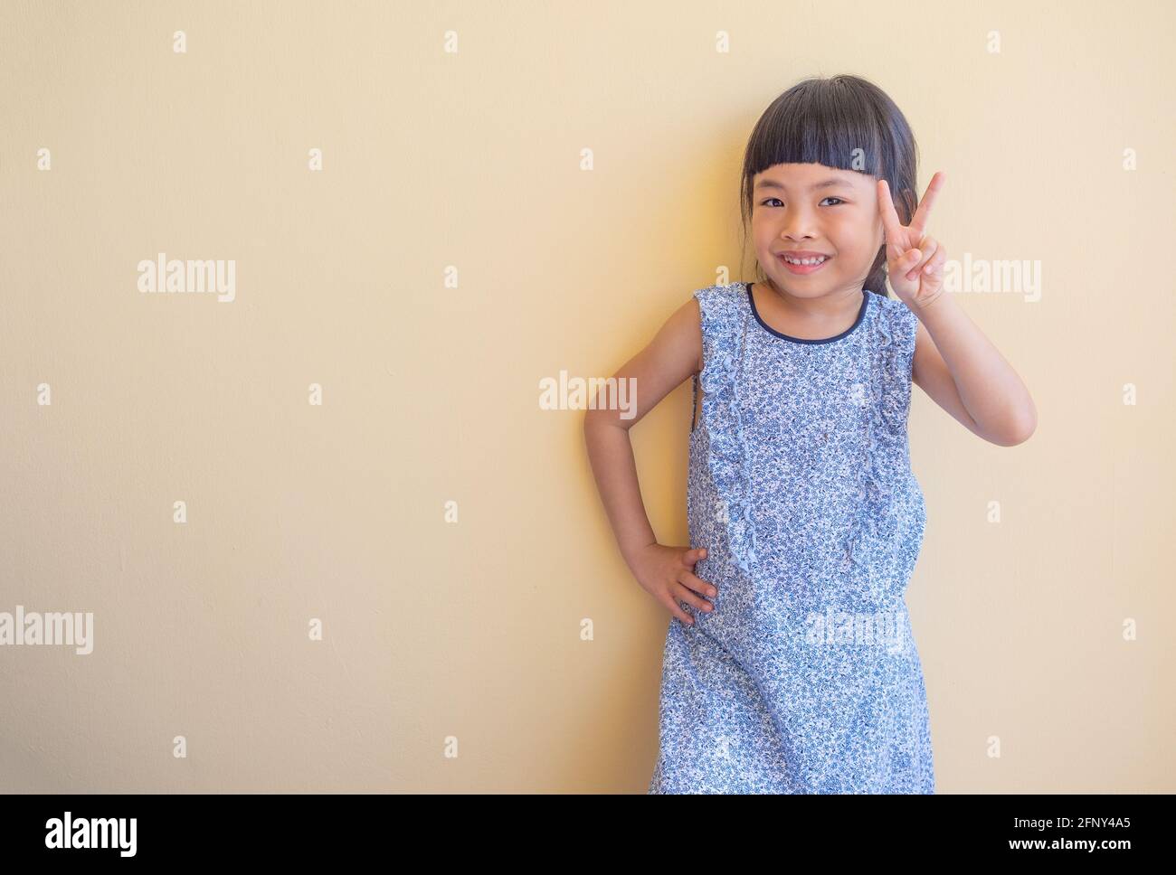 Posing with two fingers hi-res stock photography and images - Alamy