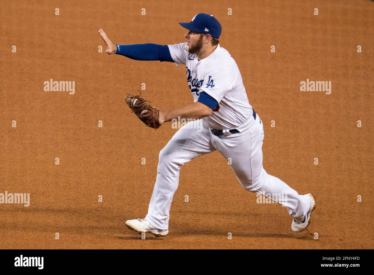 Los Angeles Dodgers first baseman Max Muncy (13) waives off starting ...