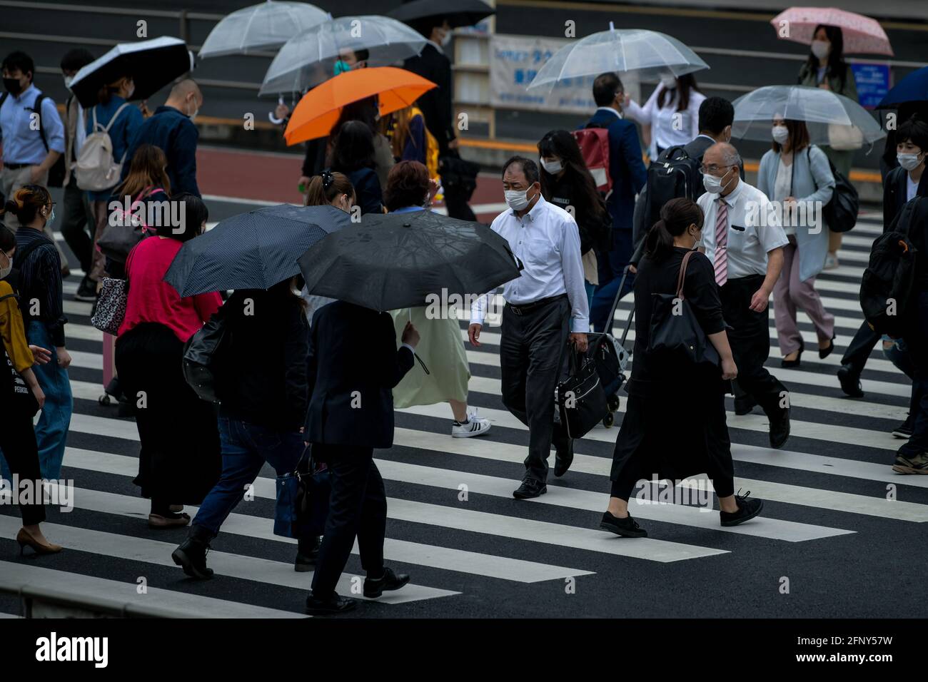 Tokyo, Japan. 19th May, 2021. People wearing face masks as a precaution ...