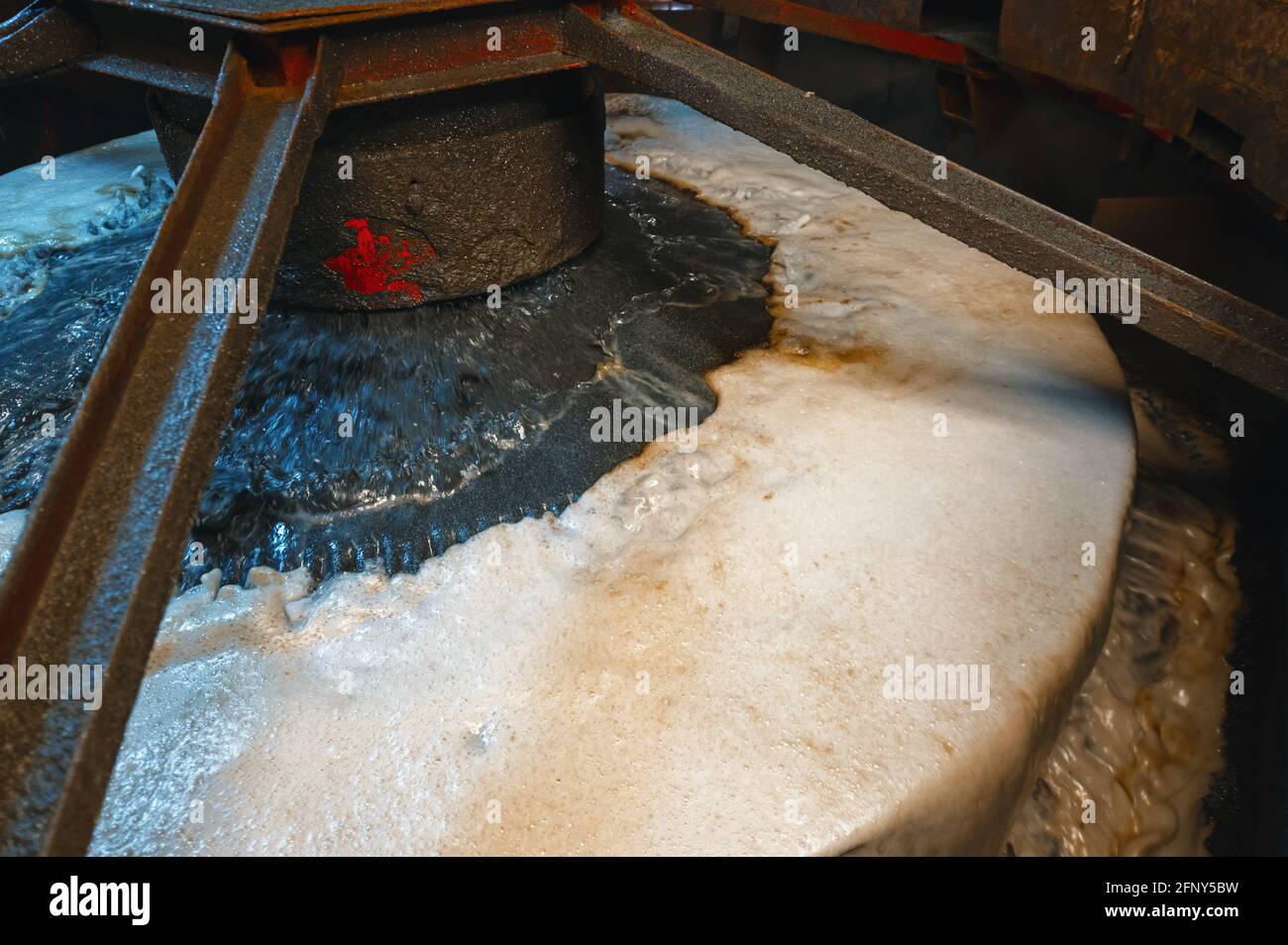 Industrial flotation process. Shooting close-up. The stream of liquid ...