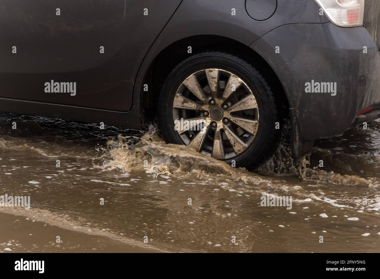 Deep puddle on a dirty road hi-res stock photography and images - Alamy