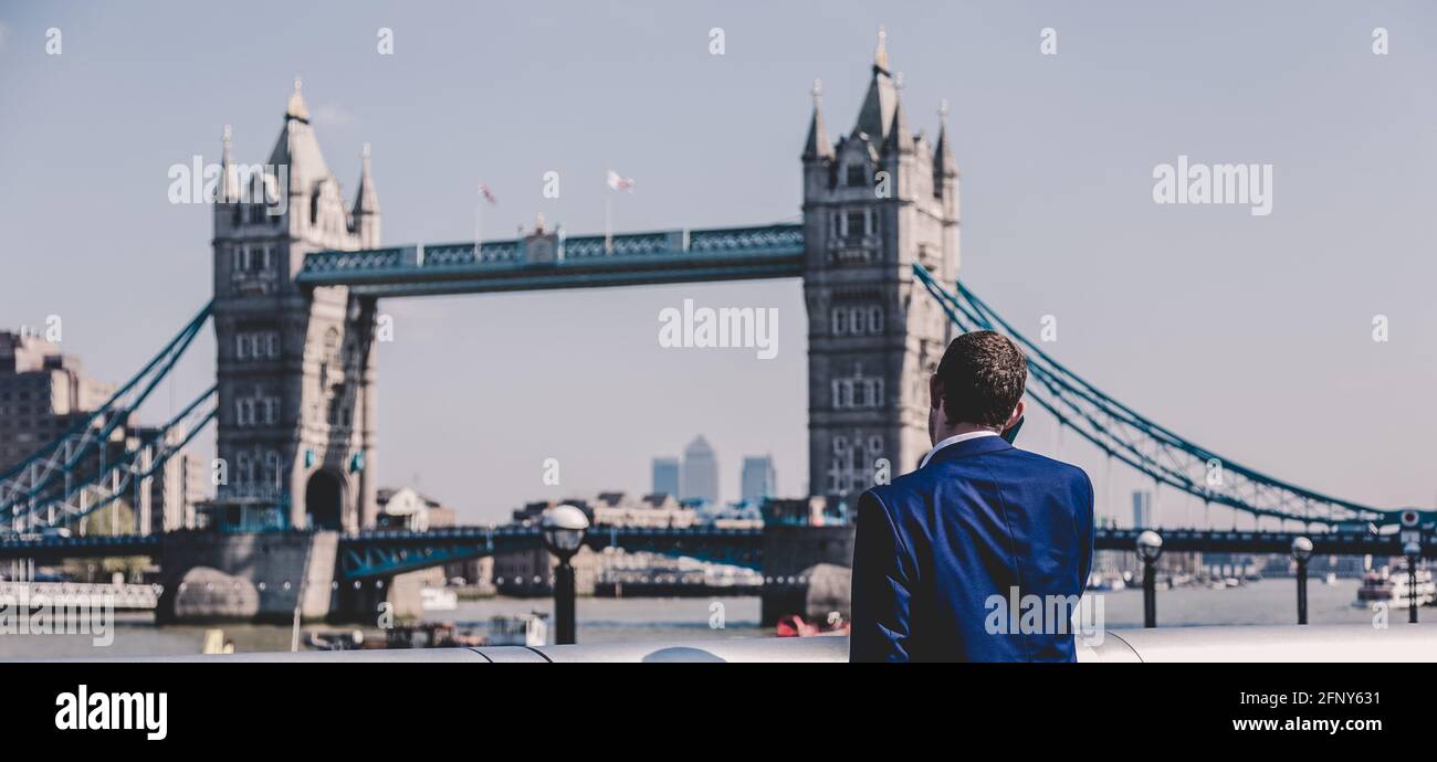 Businessman on phone tower bridge hi-res stock photography and images ...