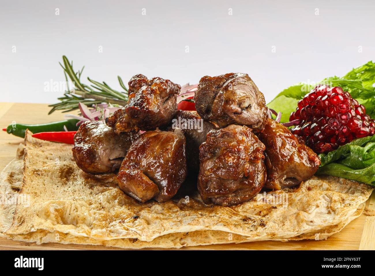 Grilled beef kebab barbeque shashlik served onion Stock Photo - Alamy