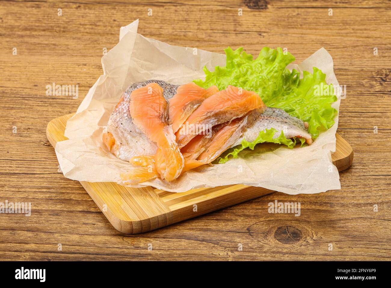 Sliced natural wild trout fillet over board Stock Photo - Alamy
