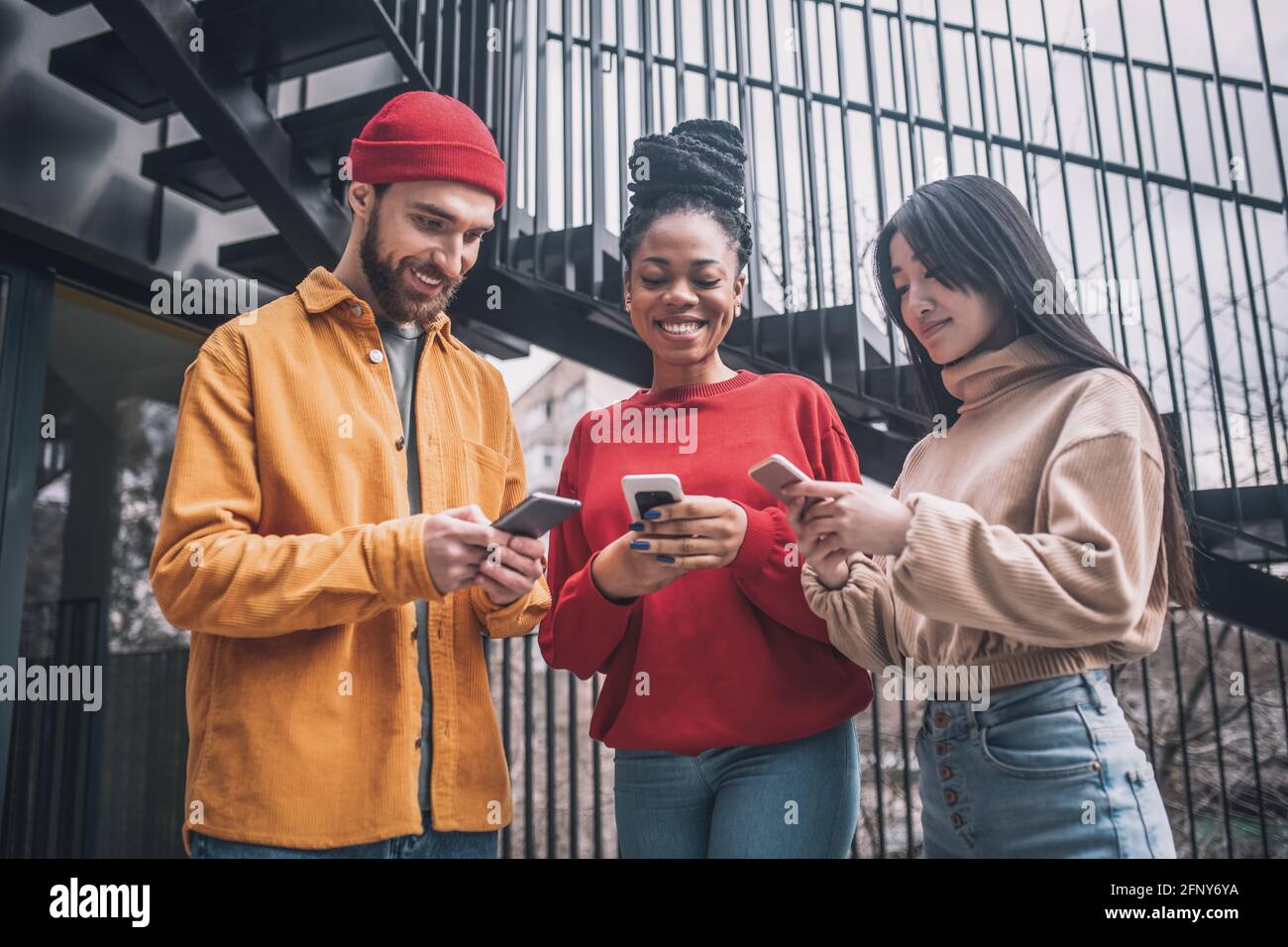 Three friends spending time together online and looking excited Stock ...