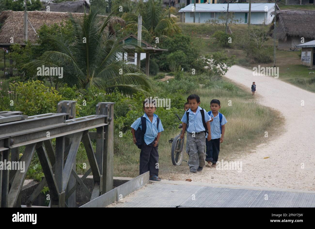 Boys walk home from school in the Mayan community of San Miguel, Toledo ...