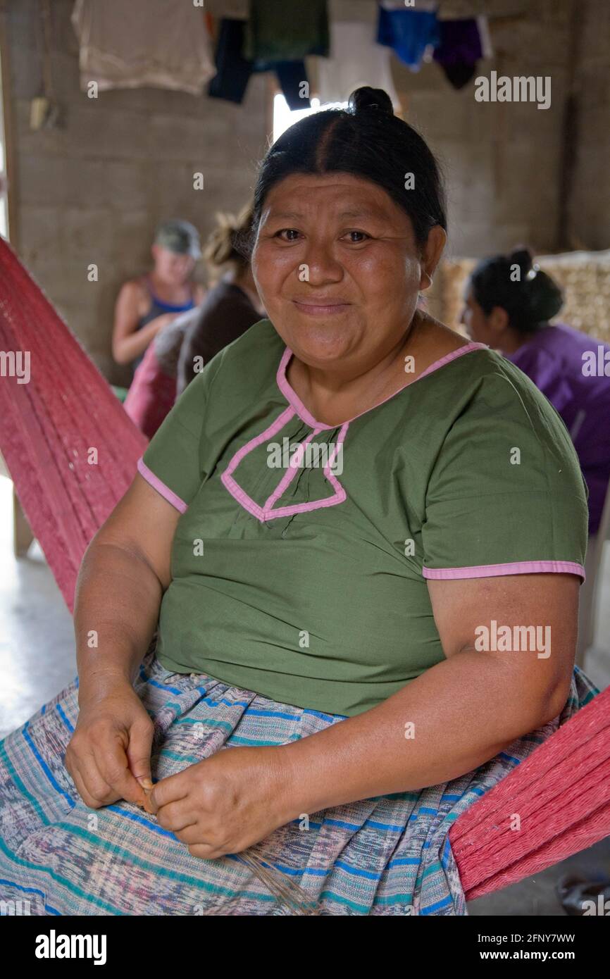 Mayan craftswoman Maria Ack displays her wares to visitors in her home ...
