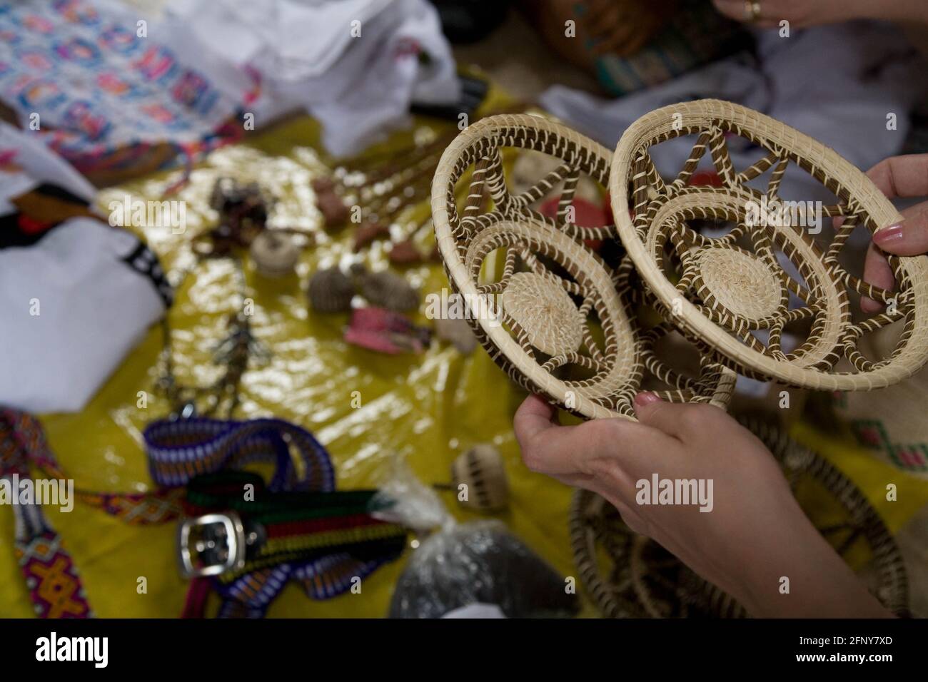 Mayan craftswomen display their wares to visitors in theior home in the ...