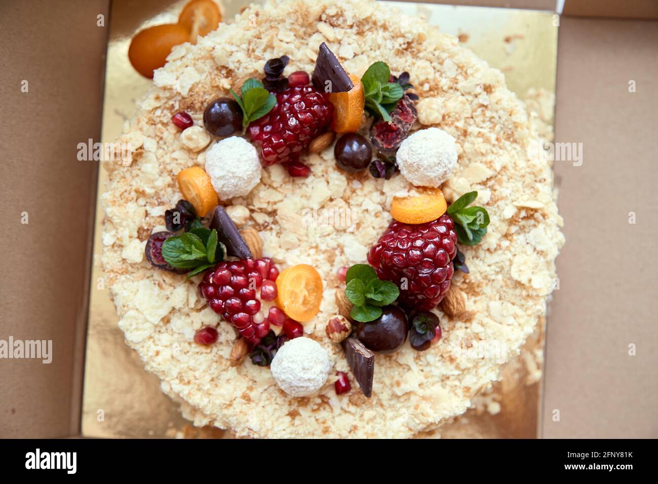 Sugar-free diet cake with honey, garnished with fruit and mint. Natural ...