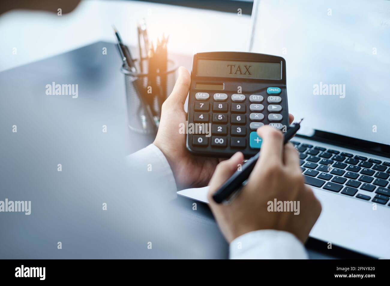 Taxes calculate hi-res stock photography and images - Alamy