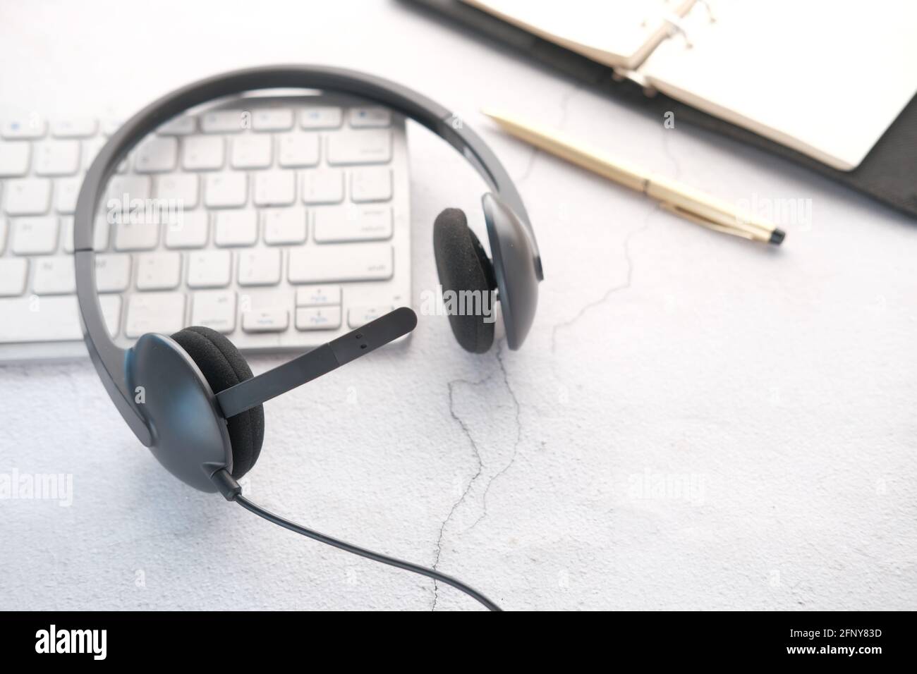 call center headphone on laptop on table Stock Photo - Alamy