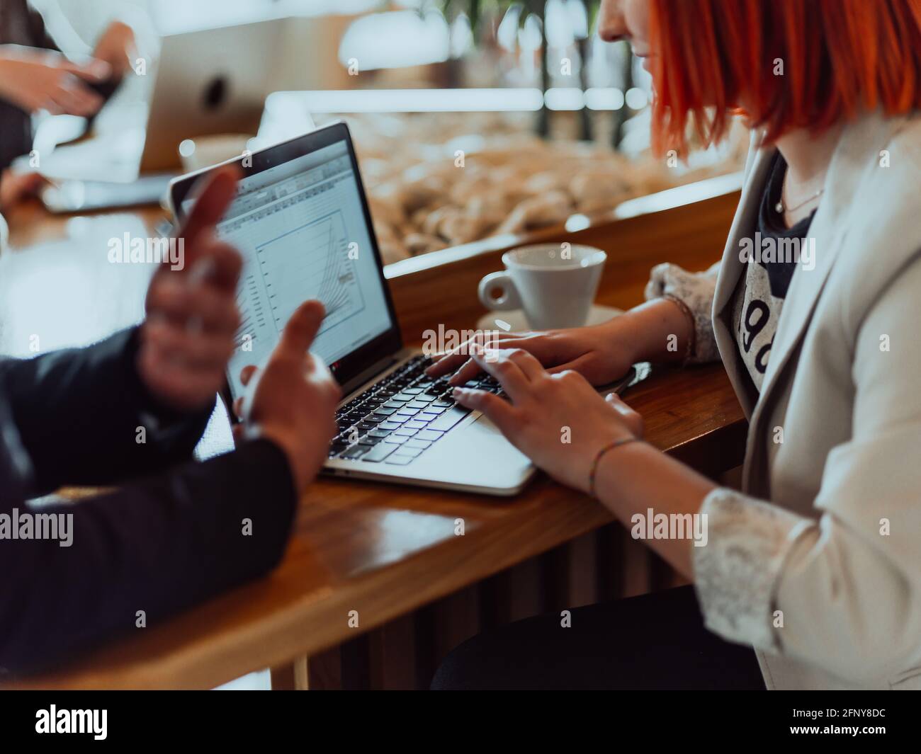 modern man and woman use modern devices, laptop, tablet and smartphone ...